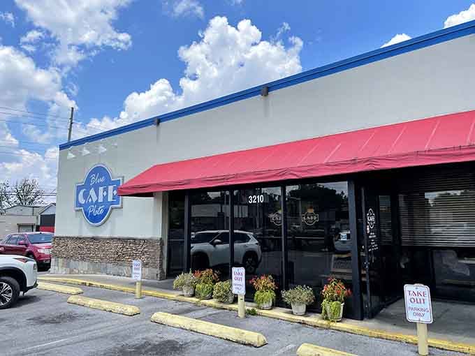 That cheerful blue and red awning is like a beacon calling you home to breakfast heaven.