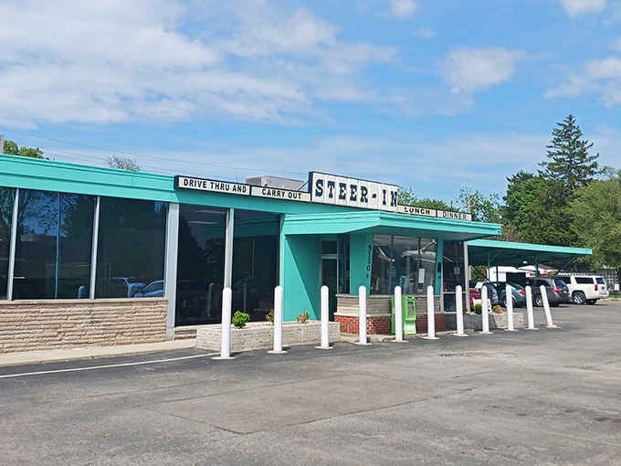 That turquoise exterior isn't just pretty, it's a beacon calling you home to burger paradise.
