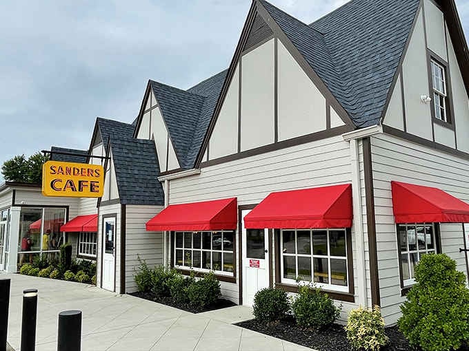 That charming Tudor-style facade with bright red awnings marks the spot where American fast food history was born.