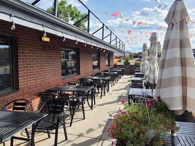 Those festive flags and striped umbrellas create a vacation vibe that makes you forget you're in landlocked territory.