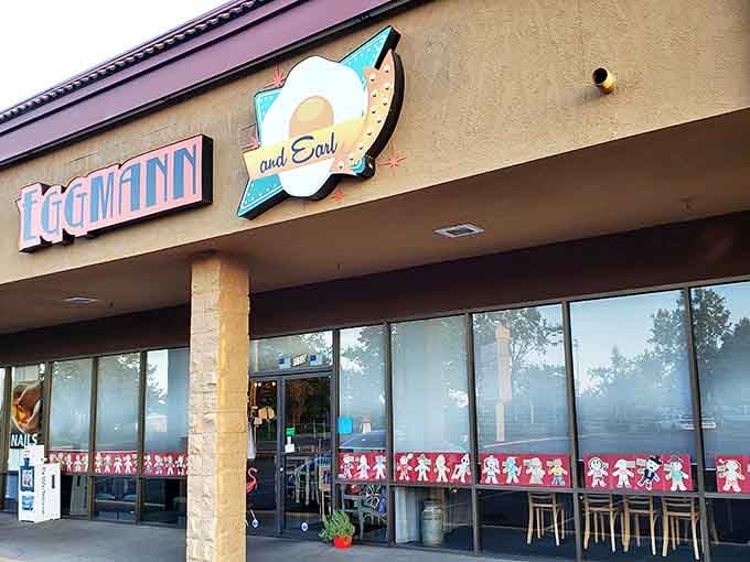 Whimsical paper cutouts decorate the windows, a first hint at the playful personality waiting inside this breakfast sanctuary.