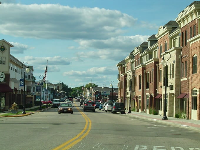 Historic brick storefronts line streets where eagles outnumber tourists during peak winter migration season.