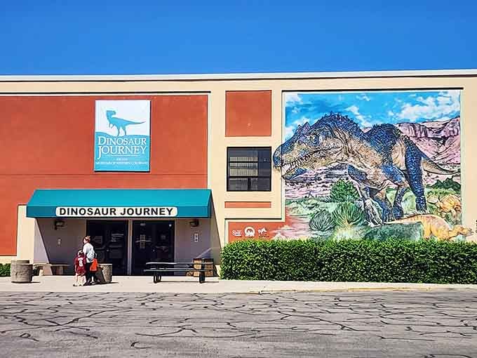 That vibrant mural outside isn't just decoration—it's a promise of the prehistoric adventure waiting inside for you.