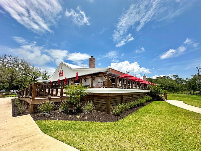 Rope railings and manicured landscaping frame the entrance where your seafood adventure officially begins with anticipation.