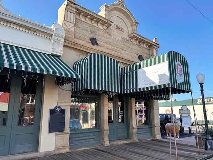 That green and white striped awning isn't just charming, it's practically waving you inside for the meal of your life.