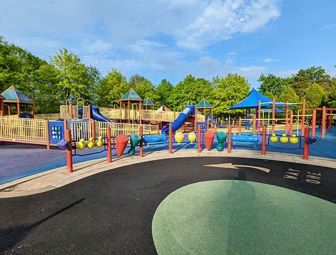 Rainbow bridges and colorful structures create a playground that looks like Willy Wonka designed it, minus the questionable safety standards and legal liability.