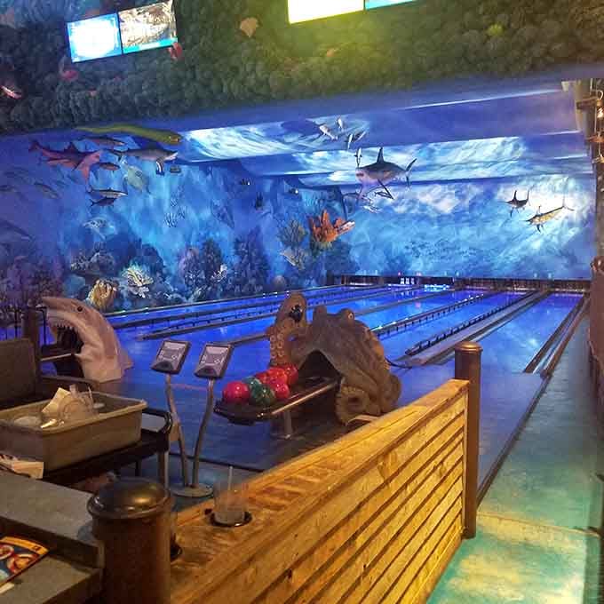 When bowling lanes meet ocean depths, you get this spectacular underwater wonderland that defies all restaurant logic.