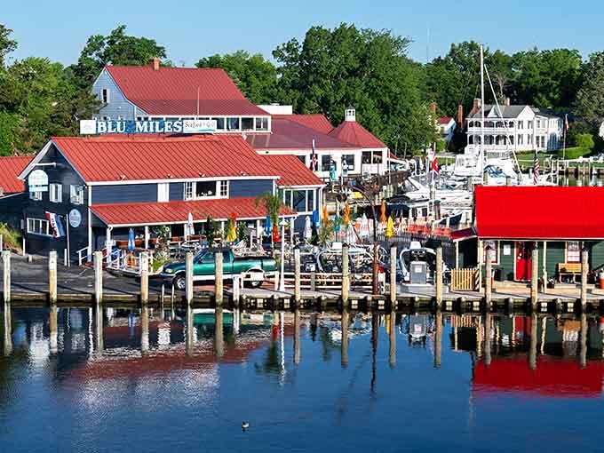 Colorful waterfront buildings reflect in the harbor like a nautical kaleidoscope come to life.