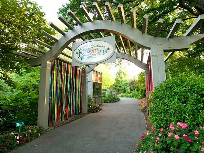 That colorful ribbon-adorned archway isn't just an entrance&mdash;it's your portal to botanical wonderland.