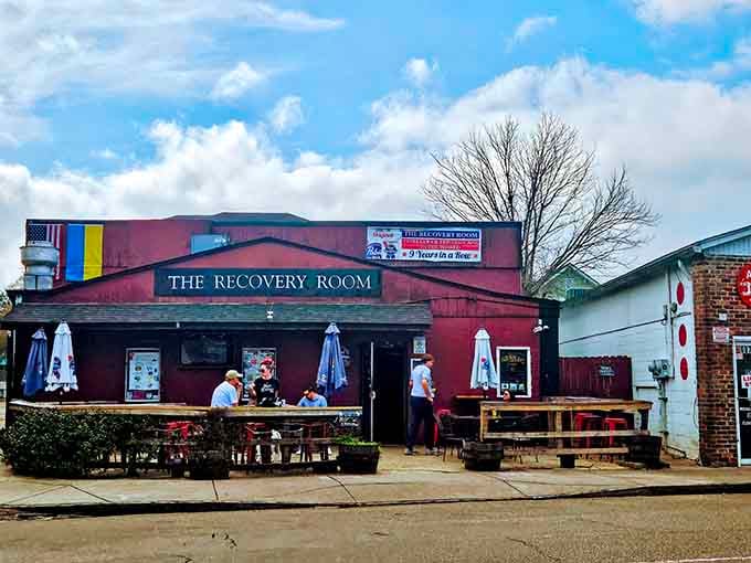 That deep burgundy exterior isn't trying to hide what's inside, it's proudly announcing dive bar paradise ahead.