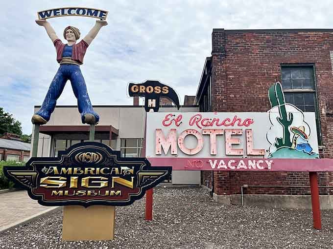 That giant cowboy holding a "WELCOME" sign isn't just greeting you, he's promising an adventure in American nostalgia.