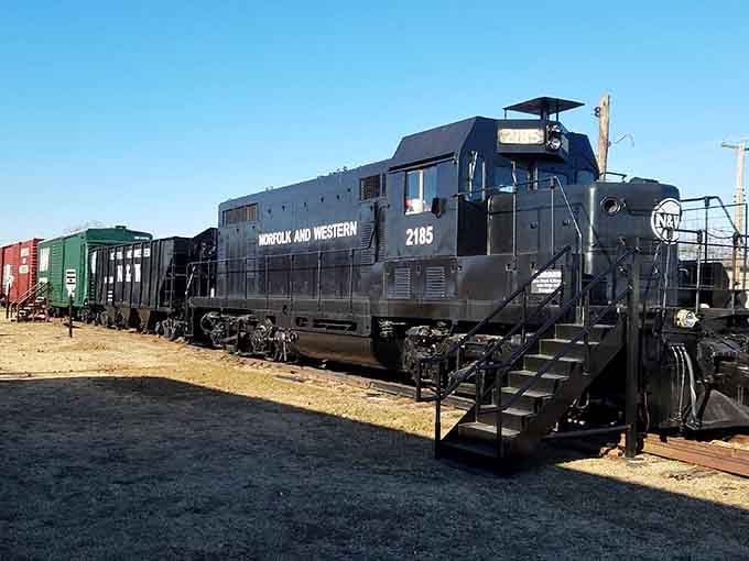 The impressive Norfolk and Western diesel locomotive stands ready for exploration, offering visitors a chance to experience railroad history firsthand.