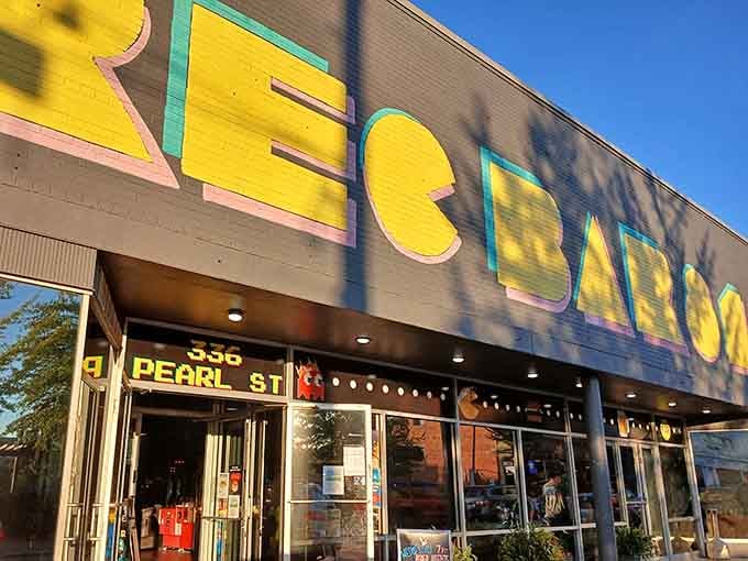 Bold signage marks the entrance to New Albany's premier arcade bar, where classic games and cold drinks await eager players.