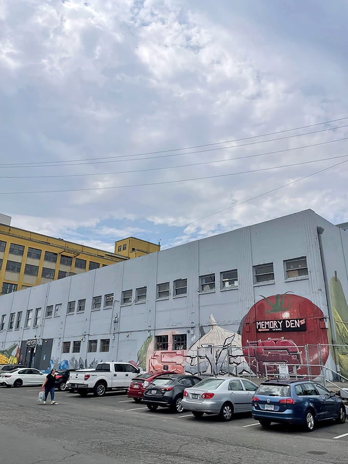 The colorful mural outside hints at the vibrant nostalgia explosion that awaits you beyond those stairs.