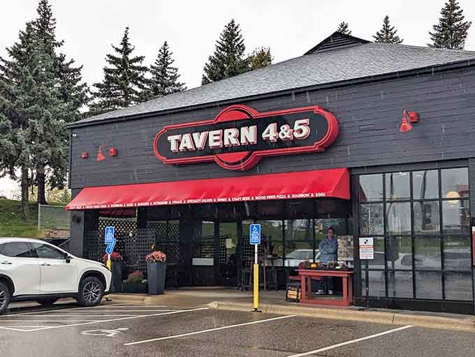 That charcoal gray exterior with the bold red awning is your first clue that breakfast magic awaits inside.