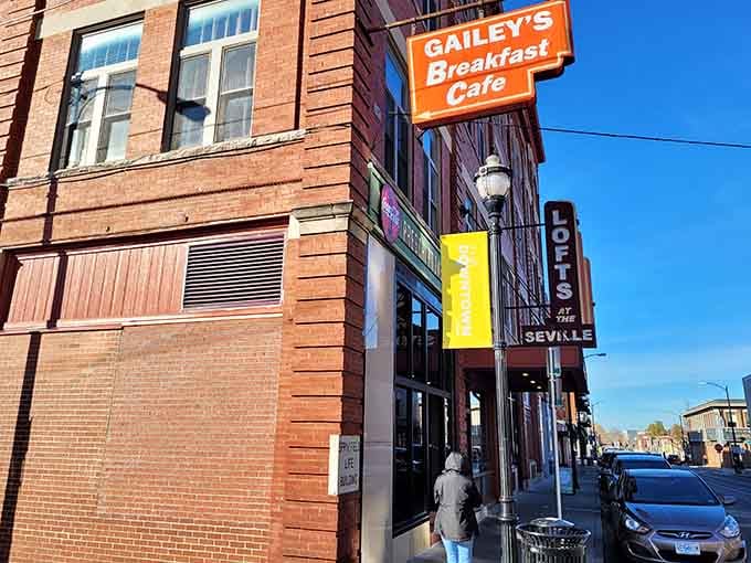 That orange sign against historic brick is your beacon to breakfast bliss in downtown Springfield's heart.