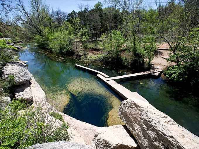 Wooden walkways guide you to water so clear, your eyes keep insisting you're looking at a postcard.
