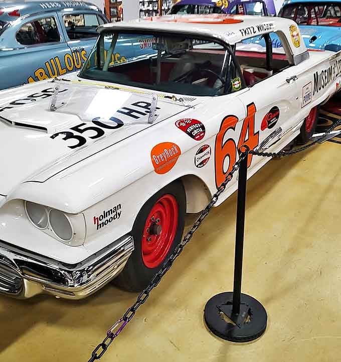 This 1959 Thunderbird #64 wears its battle scars and sponsor decals like badges of honor from a different era of racing.
