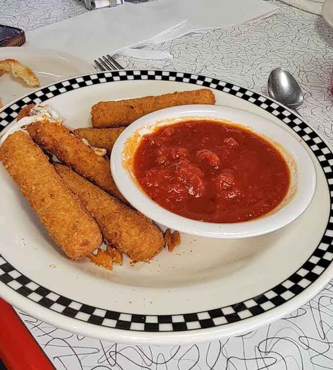 Crispy mozzarella sticks with marinara sauce make the perfect appetizer or guilty pleasure snack.