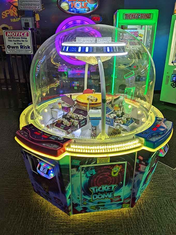 The ticket dome tempting you with prizes, turning loose change into the pursuit of plastic treasures worth approximately nothing.