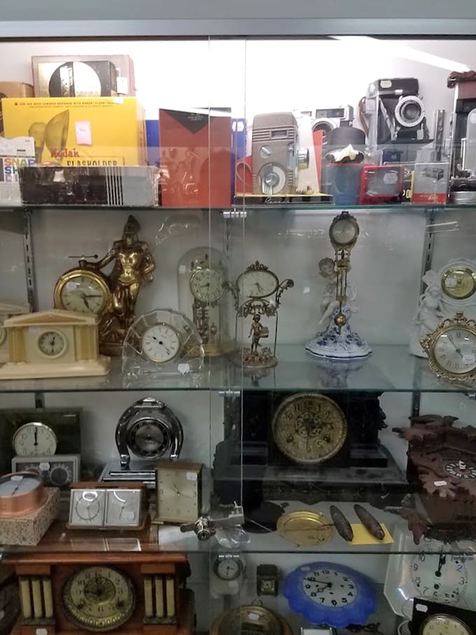 Vintage timepieces and cameras proving that before smartphones, people needed multiple devices for basic tasks.
