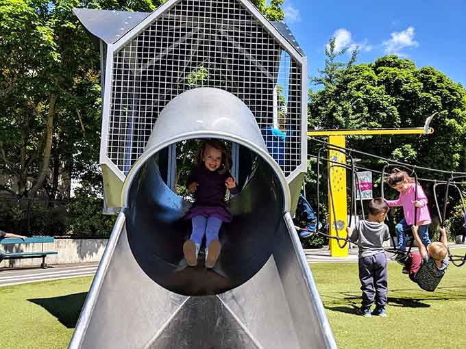 Pure joy captured mid-slide, which is basically the universal expression of childhood happiness in motion everywhere.