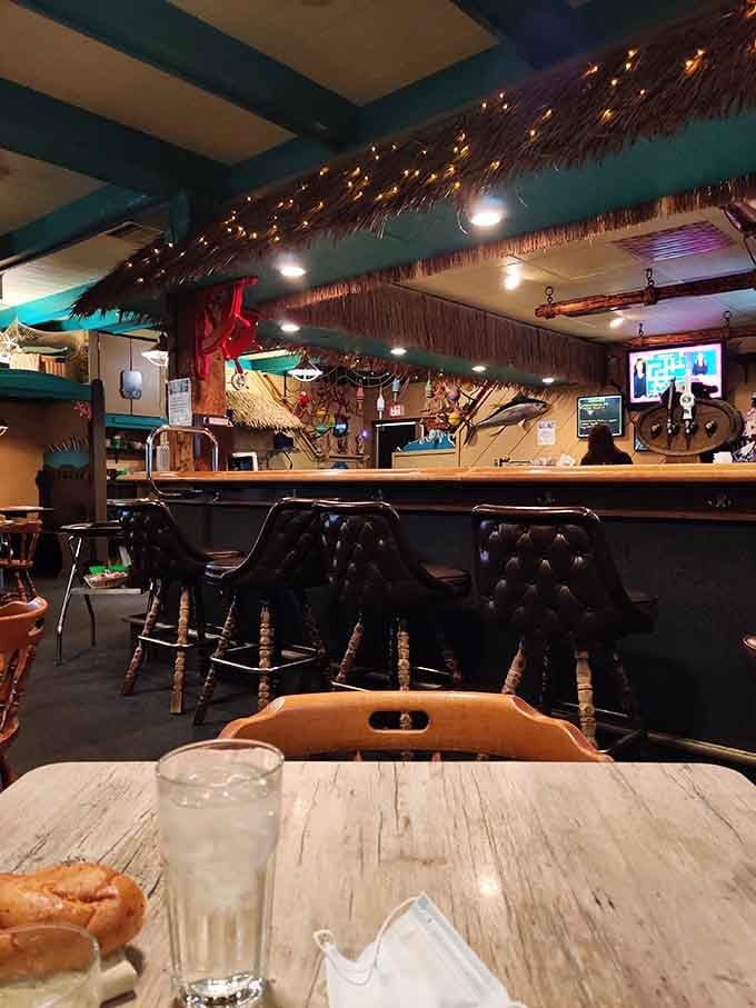 The bar at Salty's&mdash;where thatched accents and twinkling lights make every hour feel like happy hour on a tropical shore.