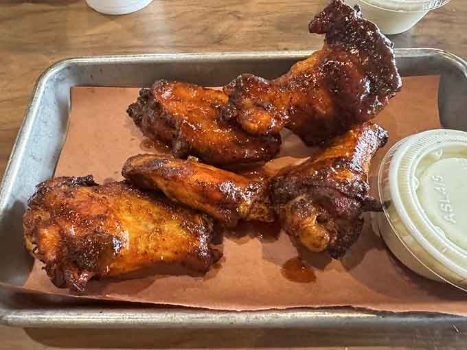 These wings wear their glaze like a badge of honor, promising flavor that'll make you forget boneless exists.