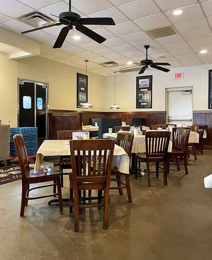 Ceiling fans, wooden chairs, and white tablecloths create that timeless diner atmosphere we all love.