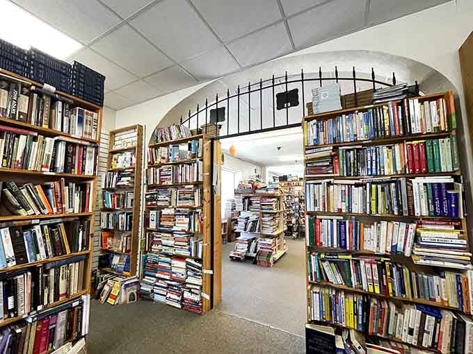 An archway made entirely of books feels like walking through a portal into another dimension where stories reign supreme forever.