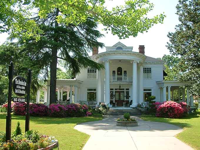 The Breeden Inn stands as a magnificent testament to Southern grandeur, where azaleas frame columns that have witnessed generations of Bennettsville stories.