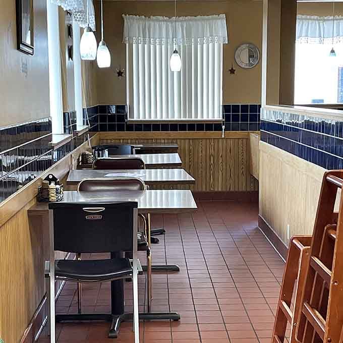 Booth seating with pendant lighting creates that perfect diner atmosphere where conversations flow as freely as the coffee refills.