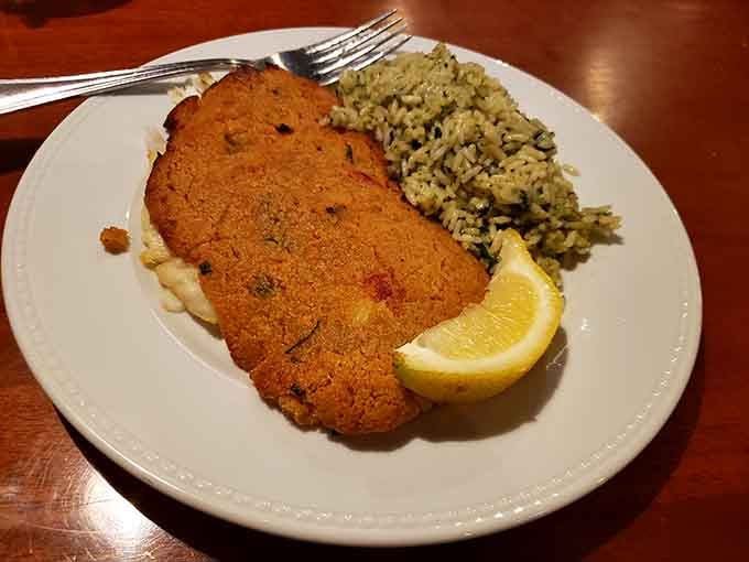 Crispy-coated fish with a side of vibrant rice. Proof that sometimes the simplest preparations let quality ingredients sing their own delicious song.