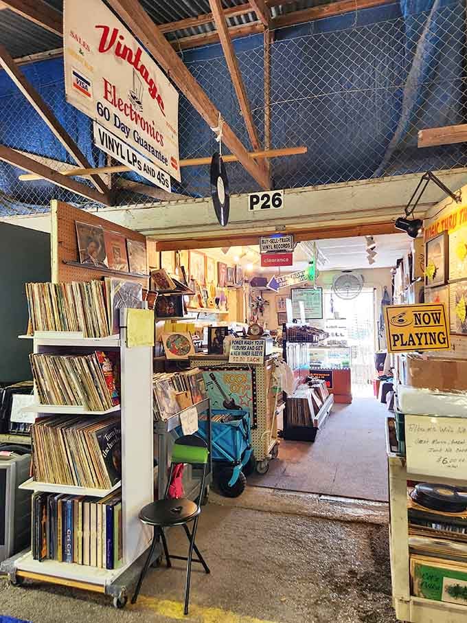 Vintage vinyl records stacked high enough to soundtrack your entire nostalgia trip, one spinning disc at a time.