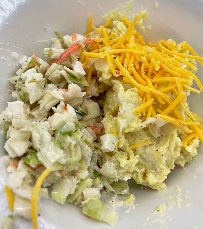 Potato salad and coleslaw sitting pretty, ready to cool down all that fried goodness on your plate.
