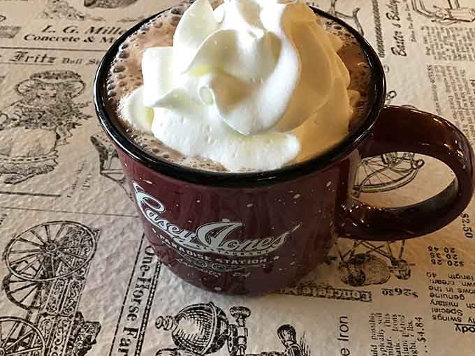 Hot chocolate topped with whipped cream in that signature mug, warming hands and hearts since forever.