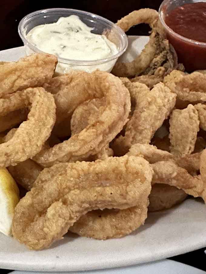 Calamari rings arrive in quantities that suggest the kitchen doesn't understand the concept of portion control, thankfully.