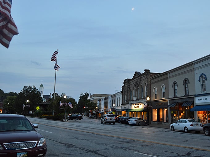 Evening descends on Main Street as streetlights flicker on and the village settles into its most photogenic hour.