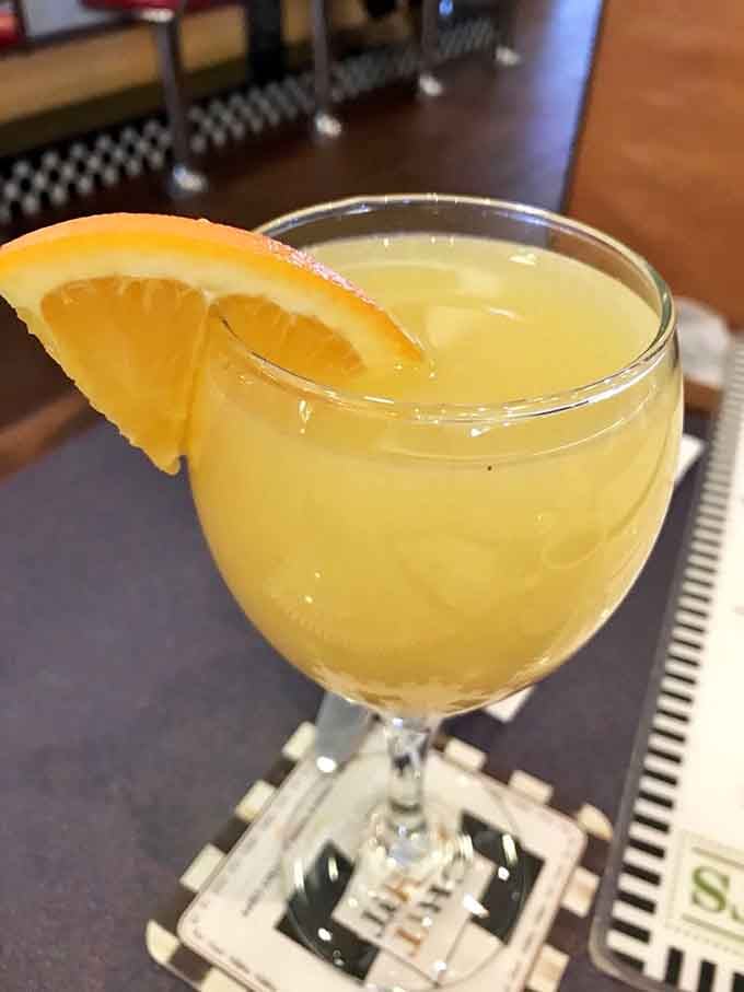 Fresh-squeezed mimosa sunshine in a glass, because brunch without bubbles is just a sad breakfast meeting.