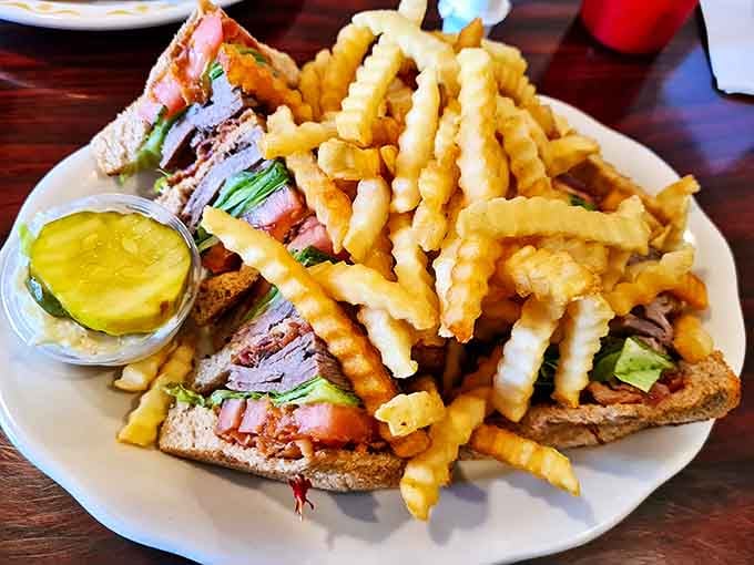 The club sandwich&mdash;architecture's greatest contribution to lunch. Triple-decker construction with perfect structural integrity and a pickle reinforcement.