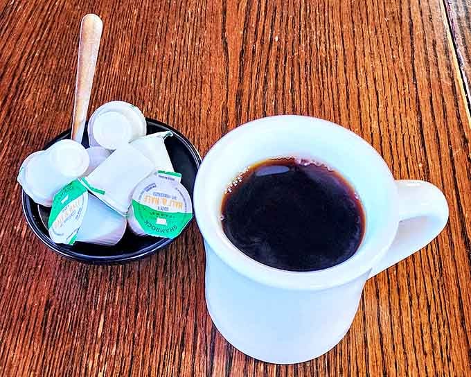 Simple black coffee in a sturdy white mug&mdash;the liquid equivalent of a firm handshake. No foam art needed when the coffee speaks for itself.