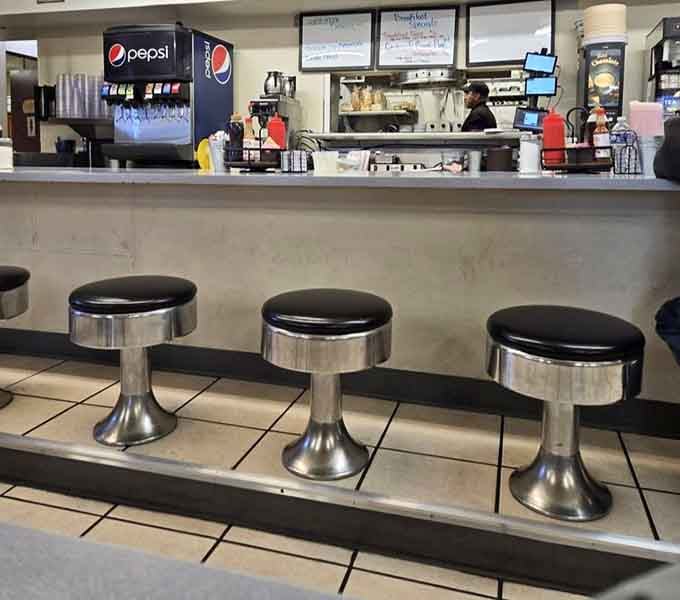 Classic counter seating where regulars have worn their loyalty into the chrome, and servers know your order before you sit down.