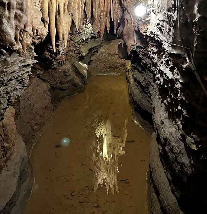 Underground pools reflect the formations above, doubling the magic and making you question which way is up.