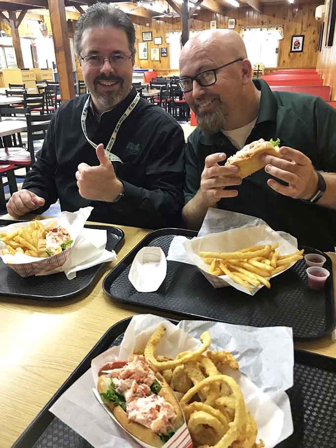 Happy diners giving the universal signal for "this is worth the drive." Food that creates instant friendships.