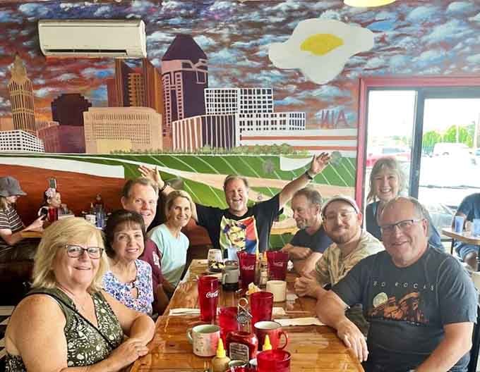 Where strangers become friends over shared food experiences. The mural of Columbus adds local flavor to this gathering of happy, well-fed humans.
