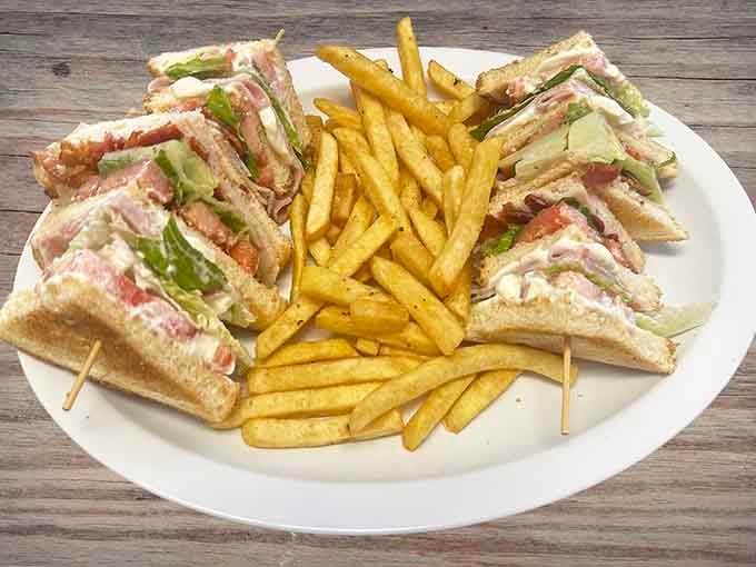A club sandwich engineered for maximum structural integrity while delivering maximum flavor in every single bite taken.