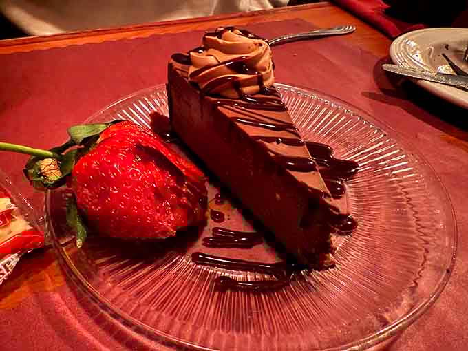 Chocolate cheesecake drizzled with enough sauce to make dessert feel like the main event you've been waiting for.