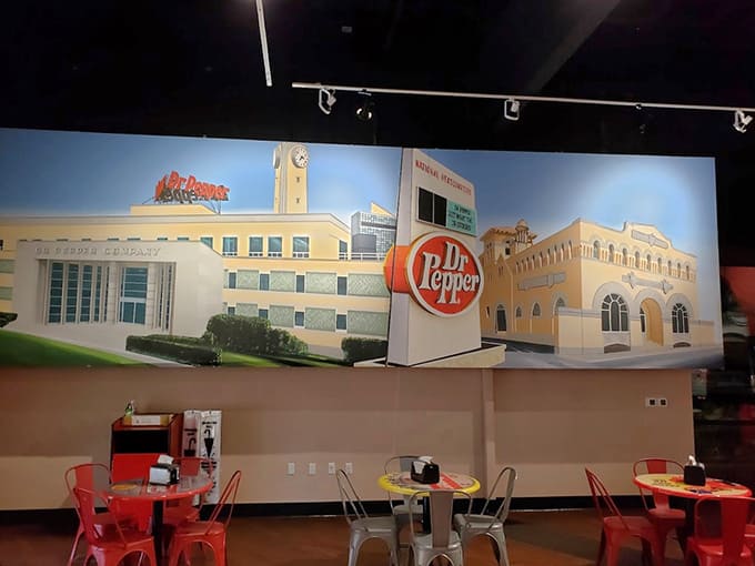 That massive Dr Pepper mural sets the stage for dining areas where you can sip the very beverage being celebrated all around you.