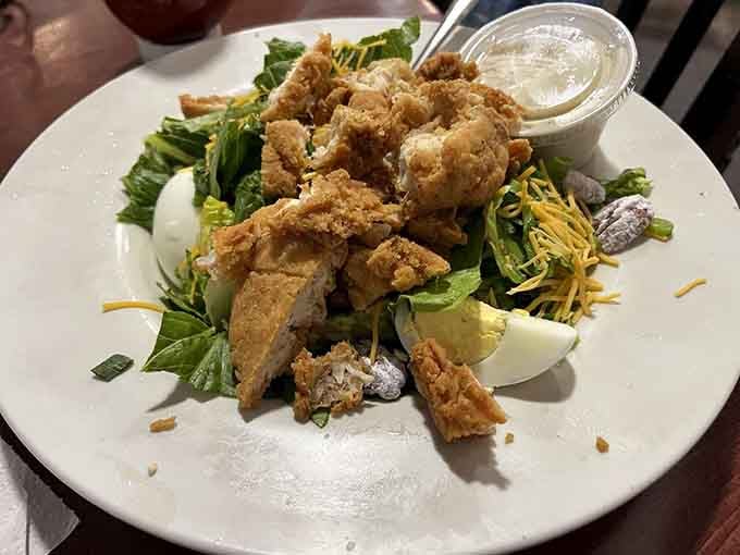Who says salads can't be exciting when they're piled high with crispy fried chicken and fresh vegetables?