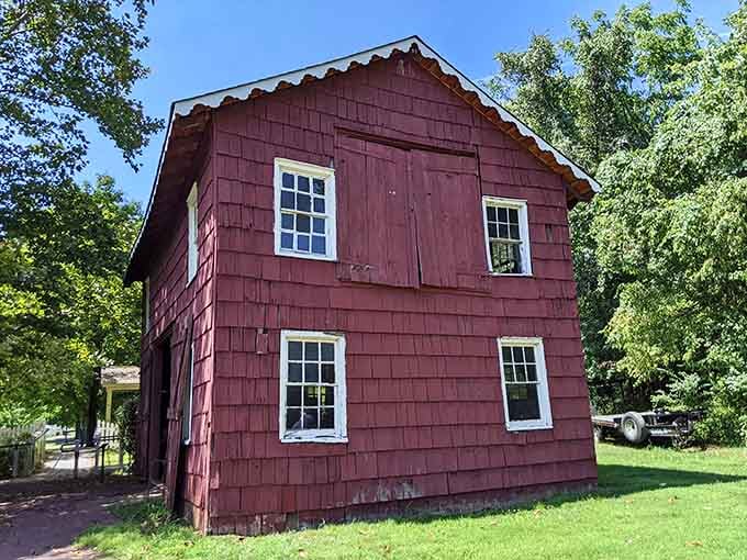 The distinctive red exterior houses workshops where blacksmiths once created everything communities needed to survive.